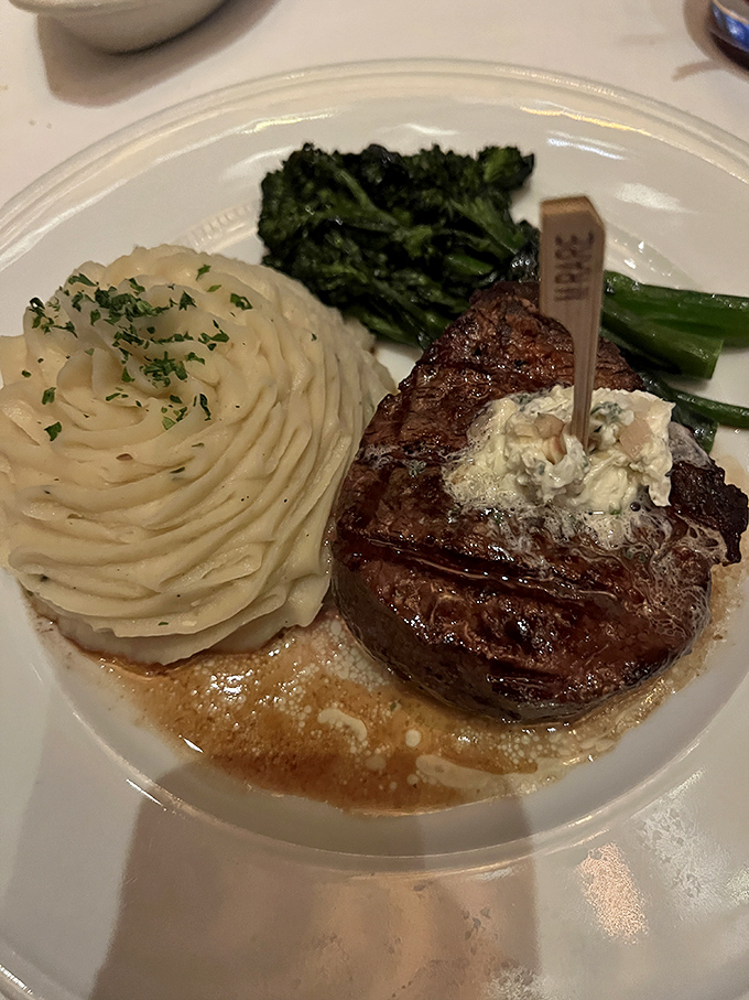 This isn't just a steak &ndash; it's a masterclass in simplicity. Perfect sear, compound butter melting seductively, and sides that don't know they're supposed to be supporting actors.