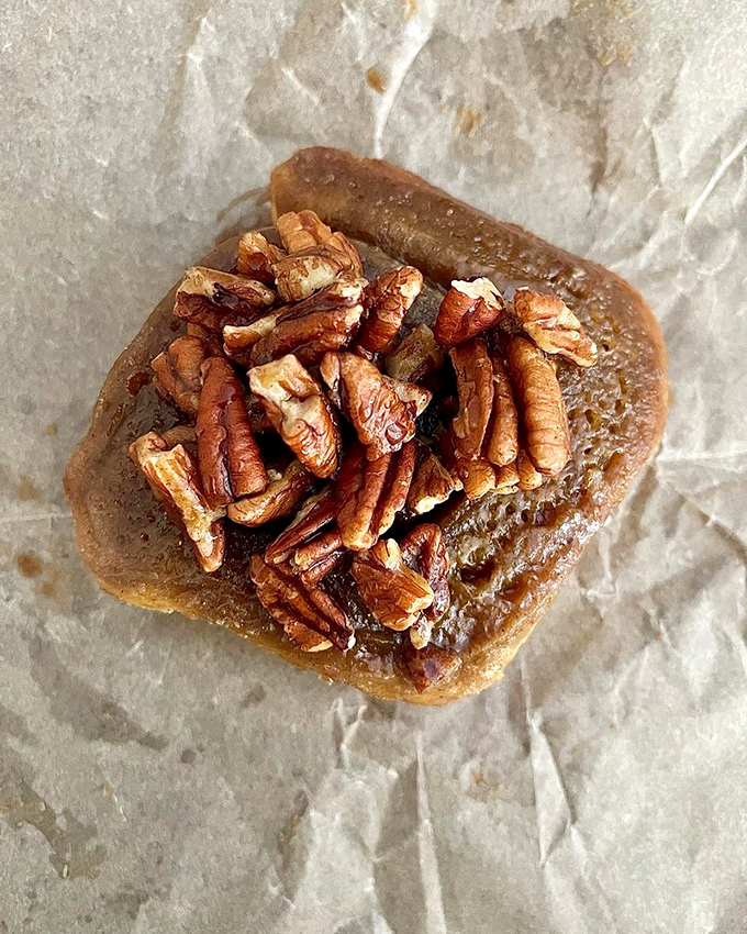 Meet the sticky bun that launched a thousand return visits. Those toasted pecans aren't just a topping&mdash;they're a crown befitting pastry royalty.