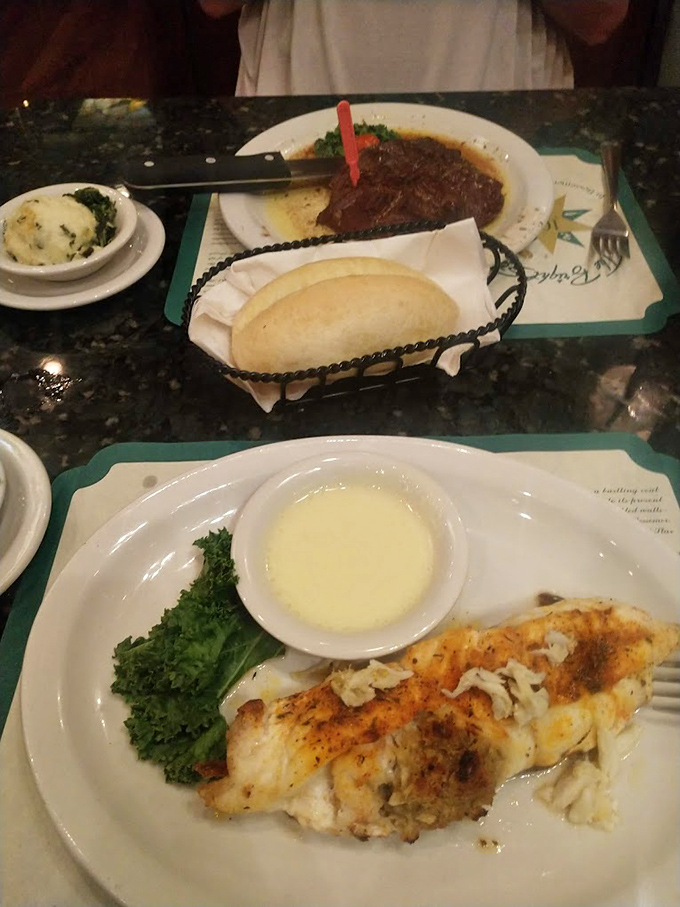 That moment when perfectly cooked fish meets its soulmate&mdash;a rich crabmeat stuffing&mdash;creating a romance that's lasted longer than most Hollywood marriages.