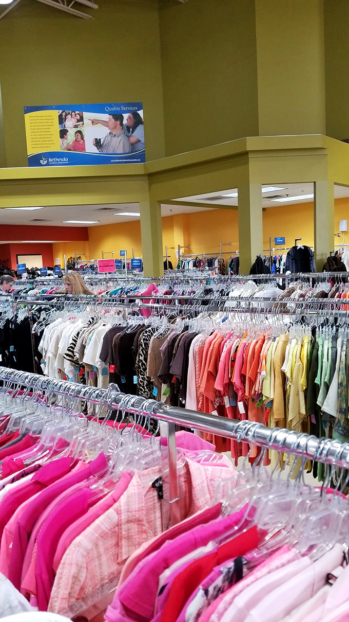 A rainbow of possibilities hangs in perfect order. Each garment tells a story and waits for its next chapter.