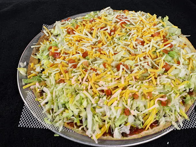 Behold the legendary Taco Pizza in all its glory &ndash; a harmonious marriage of Italian foundation and Mexican inspiration that will haunt your dreams.