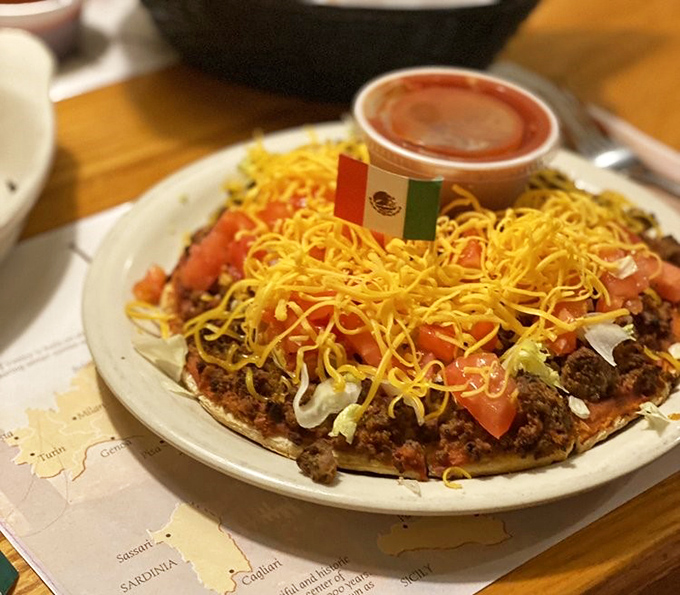 Behold the legendary taco pizza in all its cross-cultural glory! That tiny Mexican flag stands proudly atop this Ohio-Italian masterpiece.