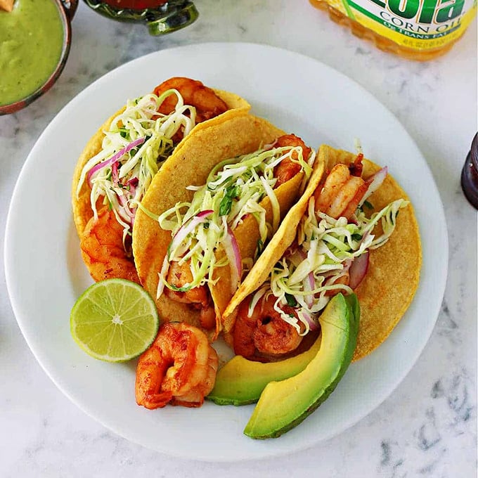 Seafood tacos that would make coastal Mexico proud, with a New England twist. That avocado isn't just garnish &ndash; it's essential diplomatic relations between cuisines.