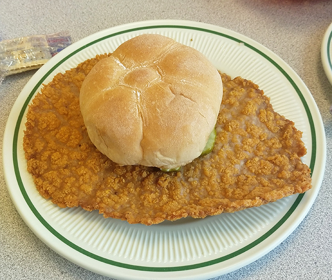 The legendary tenderloin sandwich: where the meat extends so far beyond the bun, it's like wearing a hat three sizes too small.