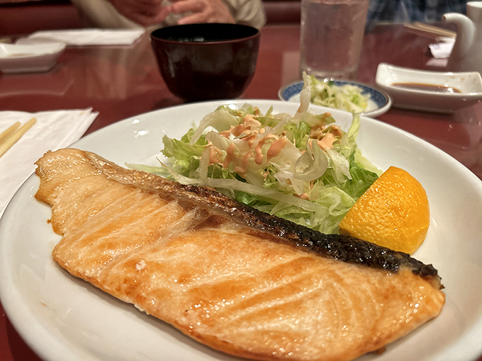 The legendary teriyaki salmon arrives like a sunset on a plate&mdash;perfectly caramelized exterior giving way to moist, flaky fish that practically melts on contact.