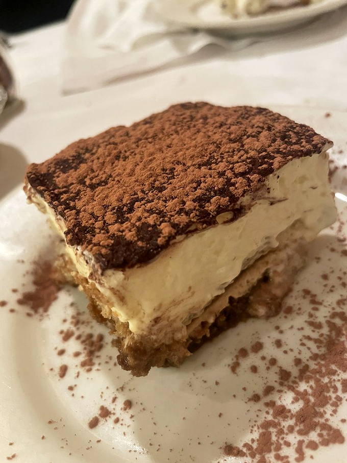 Behold the tiramisu that launched a thousand return visits. Those perfect layers aren't just dessert; they're edible architecture designed by someone who truly loves you.