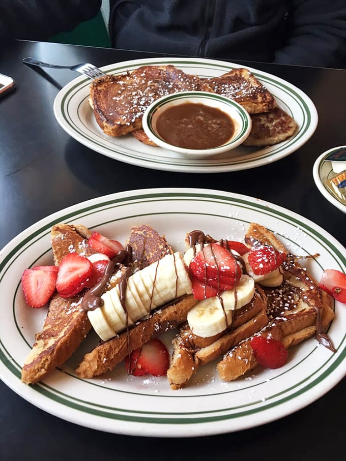 French toast nirvana achieved! Golden-brown perfection topped with fresh fruit and chocolate drizzle &ndash; worth every calorie and minute on the treadmill.