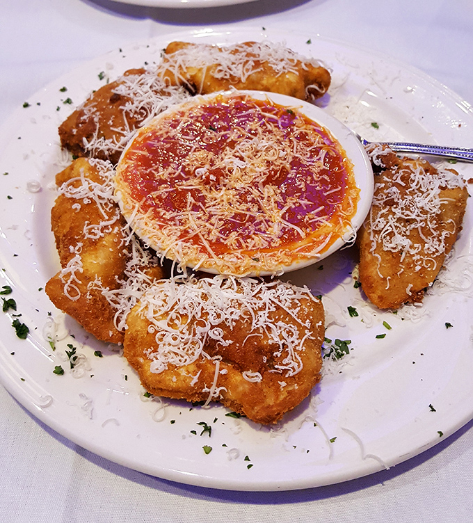 Behold the crown jewel of St. Louis cuisine &ndash; toasted ravioli that makes a compelling case for moving to Missouri. That dusting of parmesan is pure wizardry.