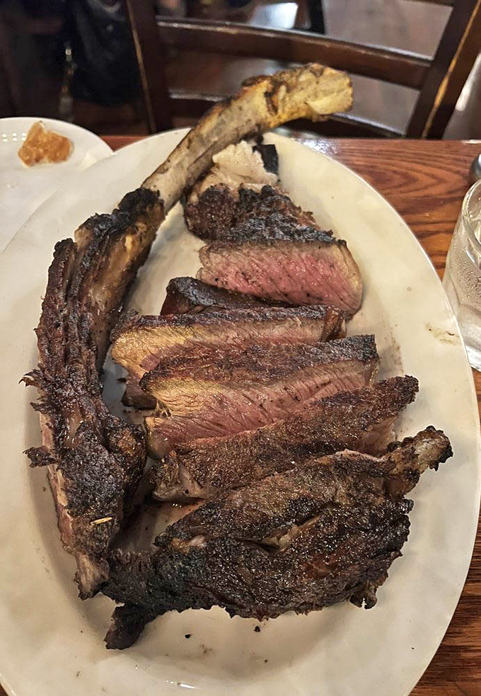 This tomahawk steak isn't just dinner &ndash; it's performance art with protein. The perfectly charred exterior gives way to a blushing pink center that would make Michelangelo weep.