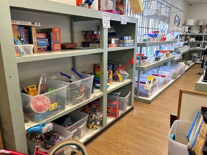 Board games and childhood treasures neatly organized, waiting to spark joy in a new generation of players. Nostalgia sold separately.