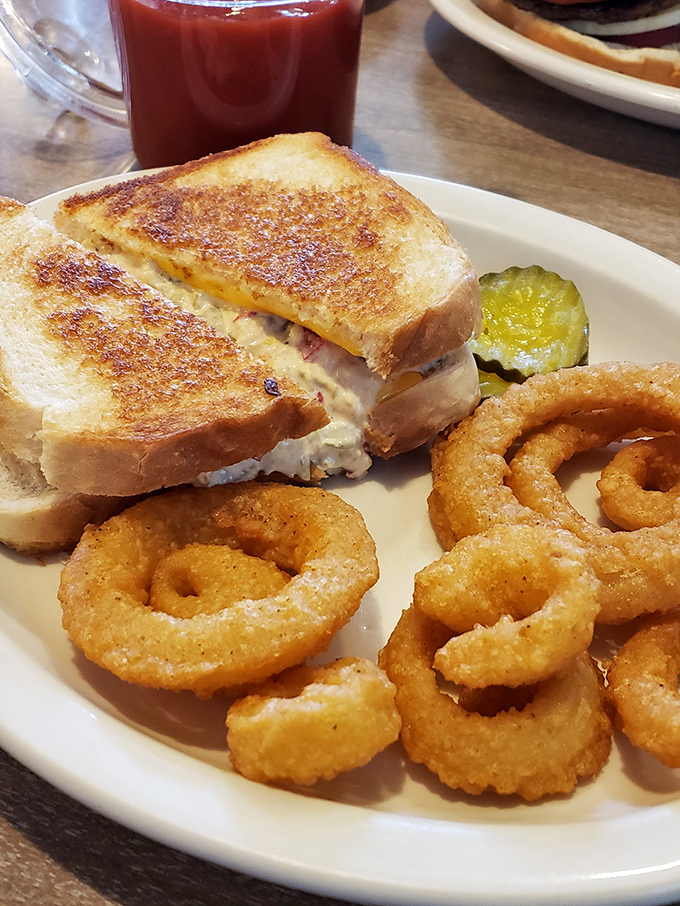 Behold the legendary tuna melt in all its glory&mdash;perfectly grilled bread, melty cheese, and a pickle spear that knows its supporting role.