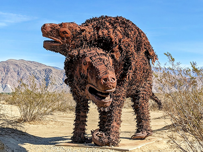 Nature's fiercest predator reimagined in rust and steel. This snarling beast looks ready to pounce despite being permanently anchored in sand.
