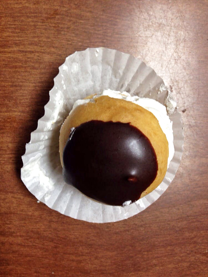 The chocolate-topped cream puff isn't just dessert, it's an edible time machine to your happiest childhood memory. One bite and you're eight again.