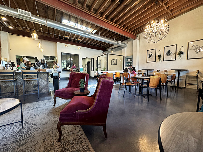 Exposed beams, elegant chandeliers, and those burgundy chairs that practically whisper "stay awhile"&mdash;this coffee shop understands the art of ambiance.
