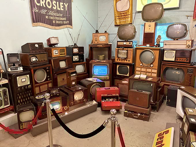 Television history stacked floor-to-ceiling&mdash;from wooden console Crosleys to Space Age portables, each one broadcasting memories from decades past.