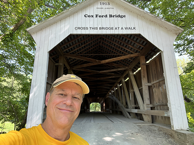 The bridge proudly displays its 1913 birthdate and gentle reminder to visitors. "Cross this bridge at a walk" - solid advice for bridges and life.