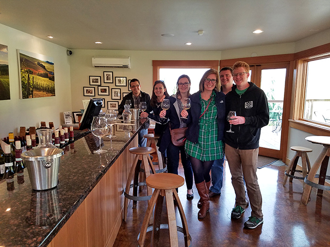 Wine brings people together! Nothing says "we're having a good day" like friends gathered around a tasting bar with glasses in hand.