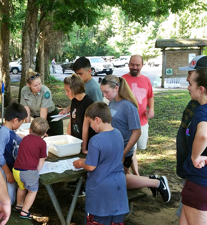 Park rangers sharing nature's secrets with tomorrow's conservationists. Knowledge transfer that doesn't require downloading an app or updating software.