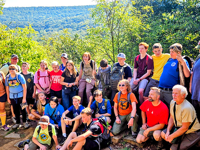 Squad goals in the great outdoors! These trail warriors paused their adventure for a group photo, immortalizing that "we conquered the mountain" moment.
