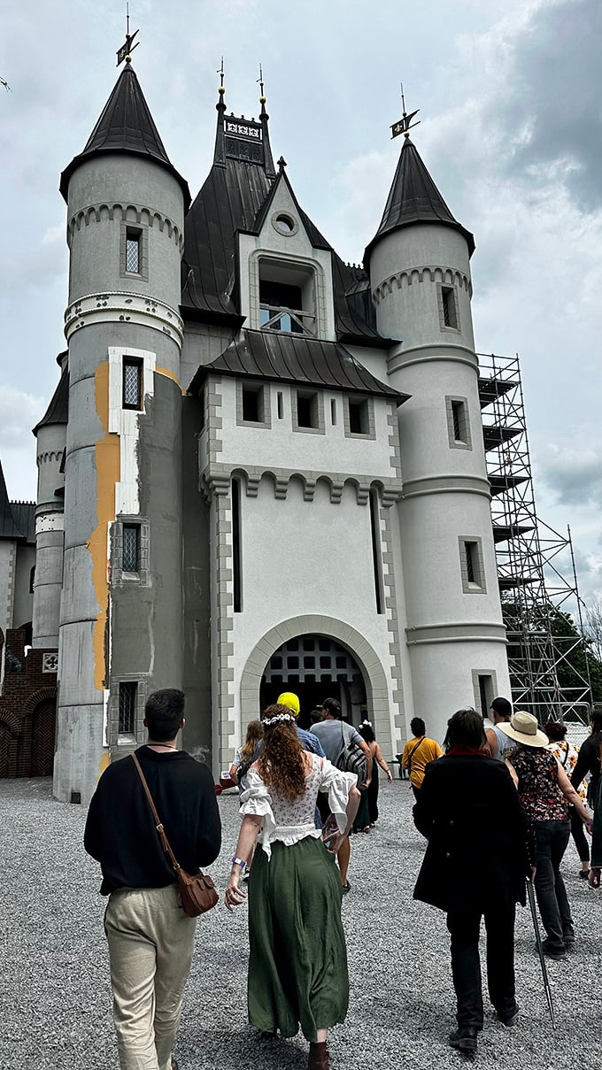 Renaissance enthusiasts make their pilgrimage to the castle gates, dressed in period attire that would make Monty Python's knights nod in approval.
