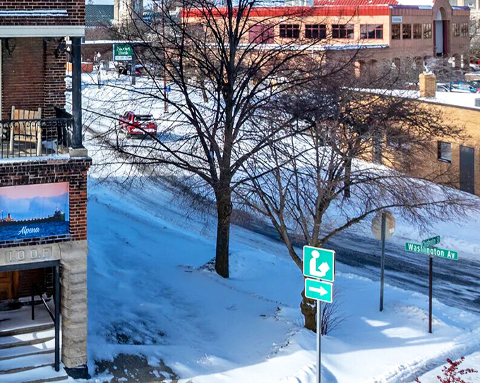 Washington Avenue in winter, where even street signs wear white hats and the pace of life slows to match the gently falling snow.