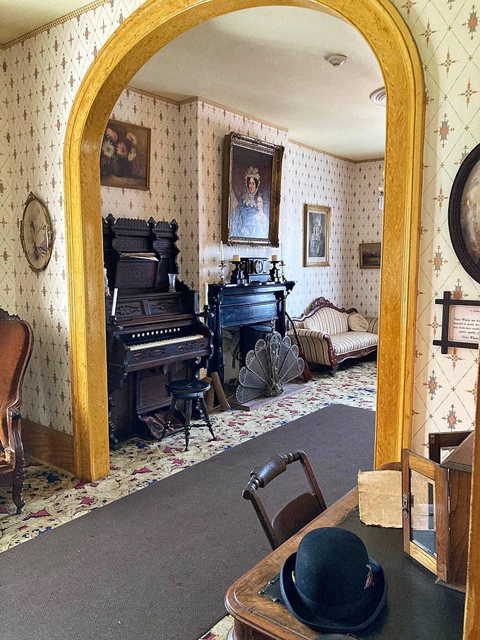 Gas lamps, ornate wallpaper, and a piano waiting for phantom fingers to play a midnight melody.