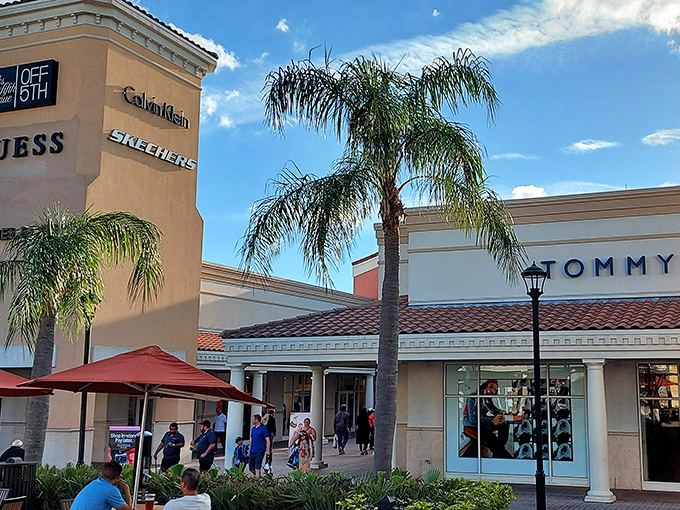 Tommy Hilfiger and Calvin Klein anchor this corner, where palm trees provide tropical ambiance for serious bargain hunting.