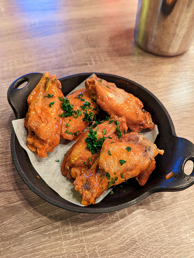 These wings aren't just cooked&mdash;they're transformed. Glistening with sauce and garnished with herbs, they're the reason napkins were invented.