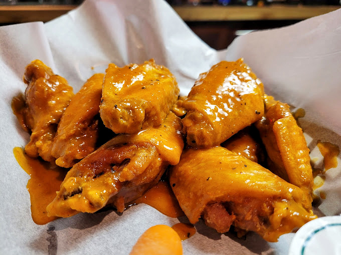 These wings aren't just good&mdash;they're the kind that make you close your eyes and forget your table manners. Crispy, saucy perfection that demands to be devoured.