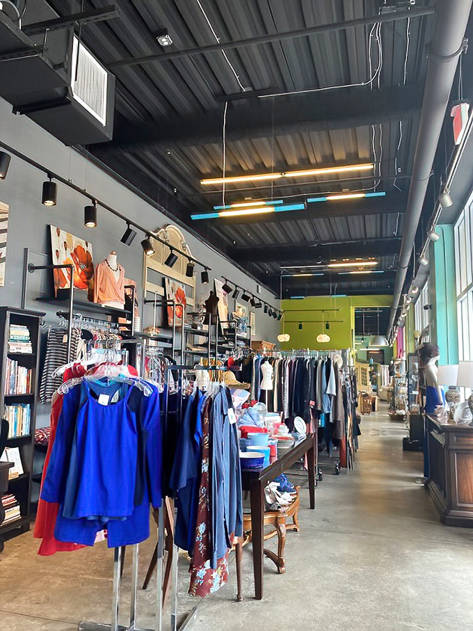Not your grandmother's thrift shop layout. Thoughtfully arranged clothing sections make finding that perfect vintage piece a delightful adventure.