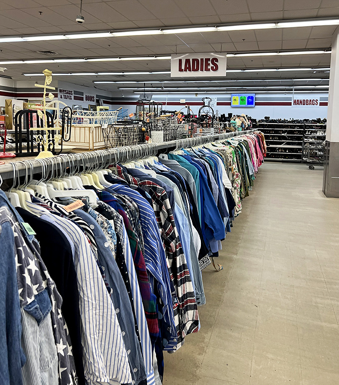 The Ladies section: where fashion goes for its encore performance. Rainbow-organized shirts create a chromatic journey through decades of style choices.