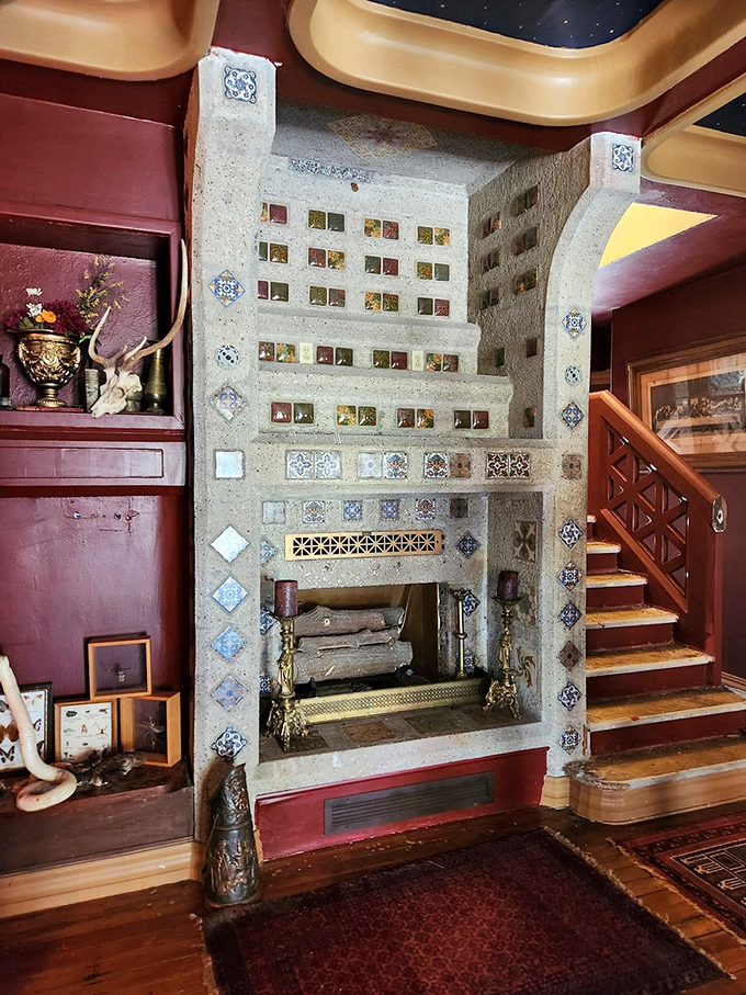 Not your average fireplace&mdash;this mosaic masterpiece with decorative tiles looks like it could secretly lead to Narnia.