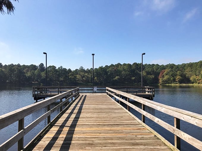 This wooden pier stretches toward possibility. Standing here at sunrise with coffee in hand? That's what vacation memories are made of.