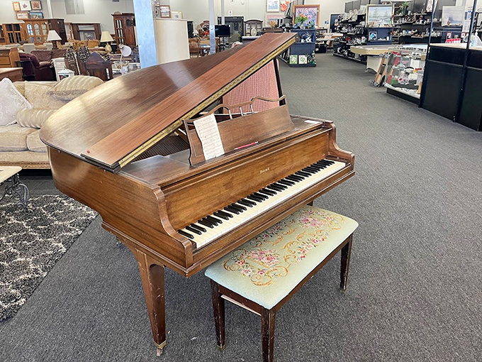 A piano that's seen more fingers than a hand model's portfolio, now waiting for its encore performance in someone's living room.