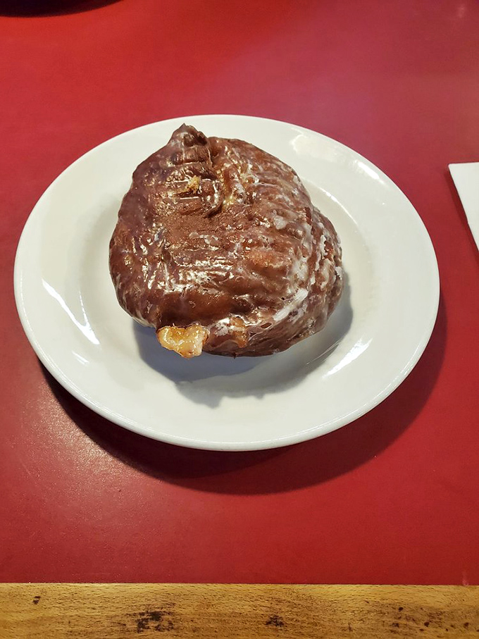 The apple fritter at DK Diner isn't just a pastry, it's an event. This craggy, glazed masterpiece could make even the most dedicated carb-avoider weak at the knees.