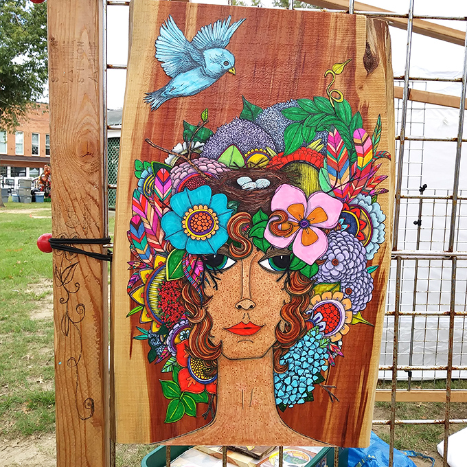 This vibrant wooden art piece transforms a simple plank into a masterpiece. Someone's living room is about to get significantly more interesting!