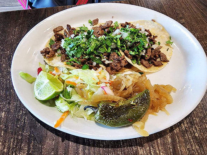 These asada tacos aren't just served&mdash;they're presented with pride. Fresh cilantro and lime standing by like faithful sidekicks to a meat superhero.