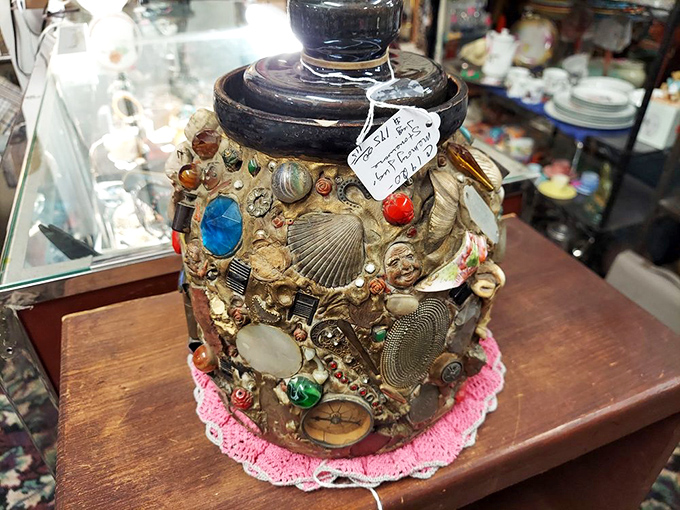 Someone's lifetime collection transformed into functional art. This memory jar captures trinkets, treasures, and tiny moments of the past.