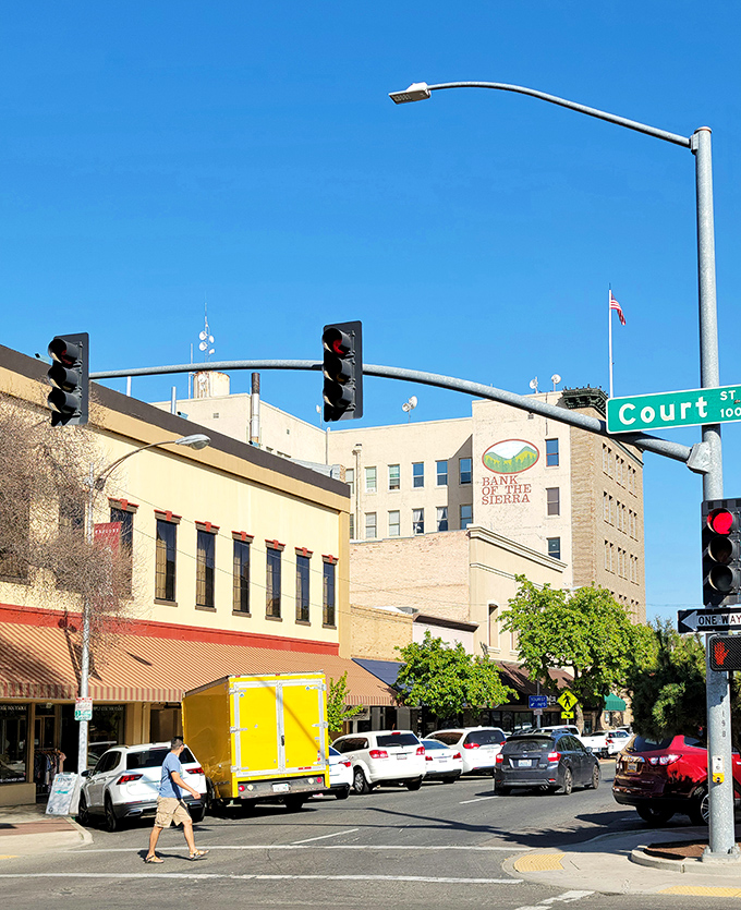 Court Street's intersection buzzes with just enough activity to feel alive without triggering your big-city traffic PTSD.