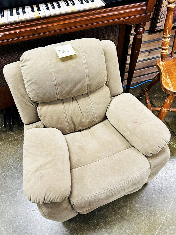 The throne of thrift royalty! This beige recliner has seen stories unfold and is ready for its next chapter in your living room.