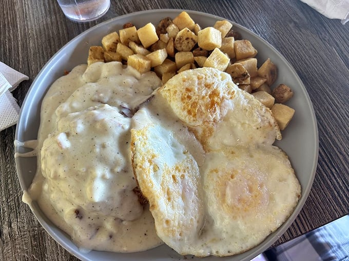 Behold the holy grail of gluten-free breakfast: biscuits smothered in peppery gravy with eggs that would make a chicken proud.