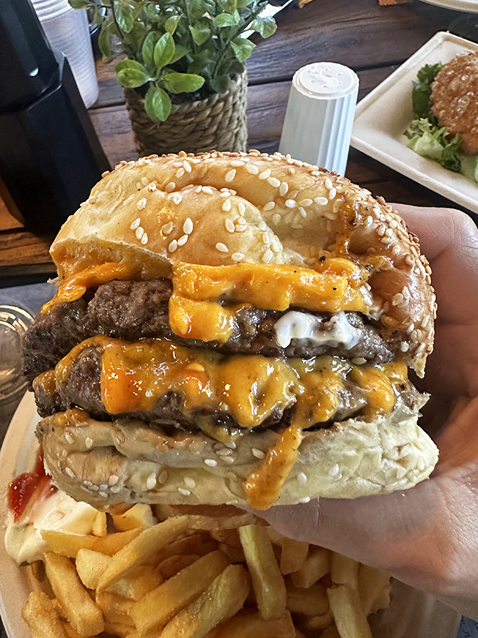 This isn't just a burger&mdash;it's architecture. Layers of melted cheese cascade down beef patties like a delicious yellow waterfall.