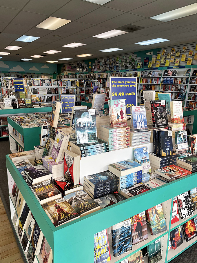 Books stacked high create a reader's paradise where hardcovers meet outlet prices in beautiful harmony.