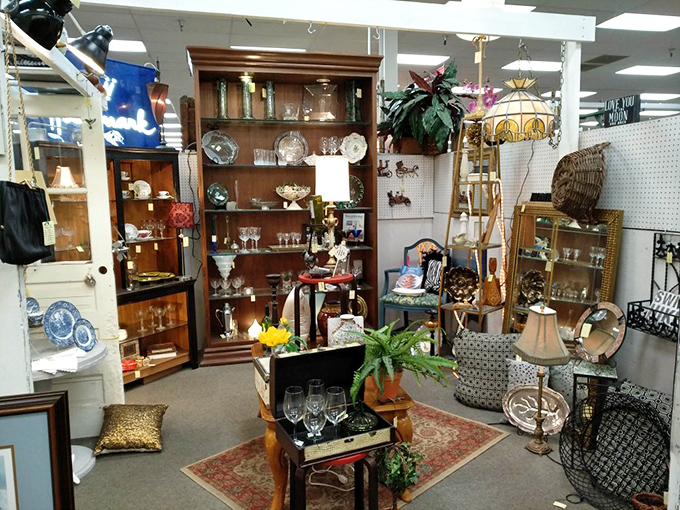This elegantly arranged booth could be a movie set for "The Crown"&mdash;crystal glassware and polished furniture waiting for their second act in someone's home.