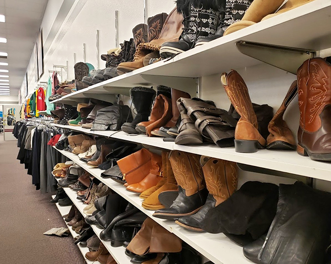 Boot paradise! These leather storytellers line up like eager contestants, each pair whispering tales of rodeos, weddings, and adventures yet to come.