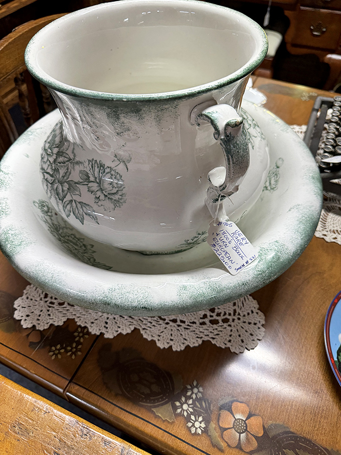 Delicate porcelain with green-trimmed florals that whispers stories of Sunday dinners and special occasions. Grandma would approve of this treasure.