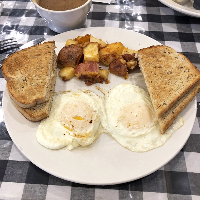 Breakfast perfection on a plate! Those sunny-side-up eggs are giving me that "everything's gonna be alright" feeling we all need.