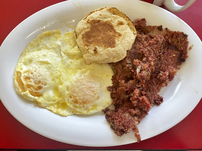 Sunny-side up eggs, a fluffy biscuit, and corned beef hash&mdash;the holy trinity of diner breakfasts done right.