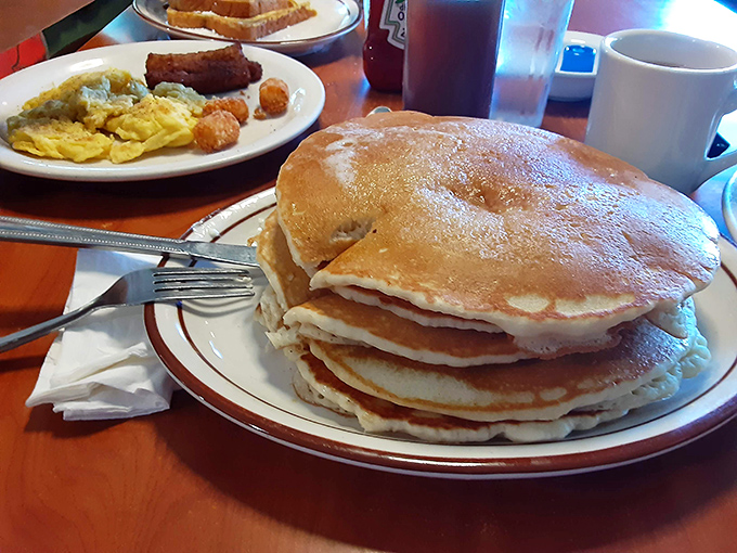 These pancakes don't just arrive at your table; they make an entrance &ndash; fluffy, golden discs that deserve their own spotlight and standing ovation.