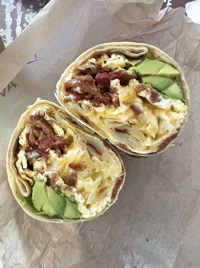 Breakfast burritos should always look like this—eggs, bacon, and avocado wrapped in a tortilla hug that says "good morning" in any language.
